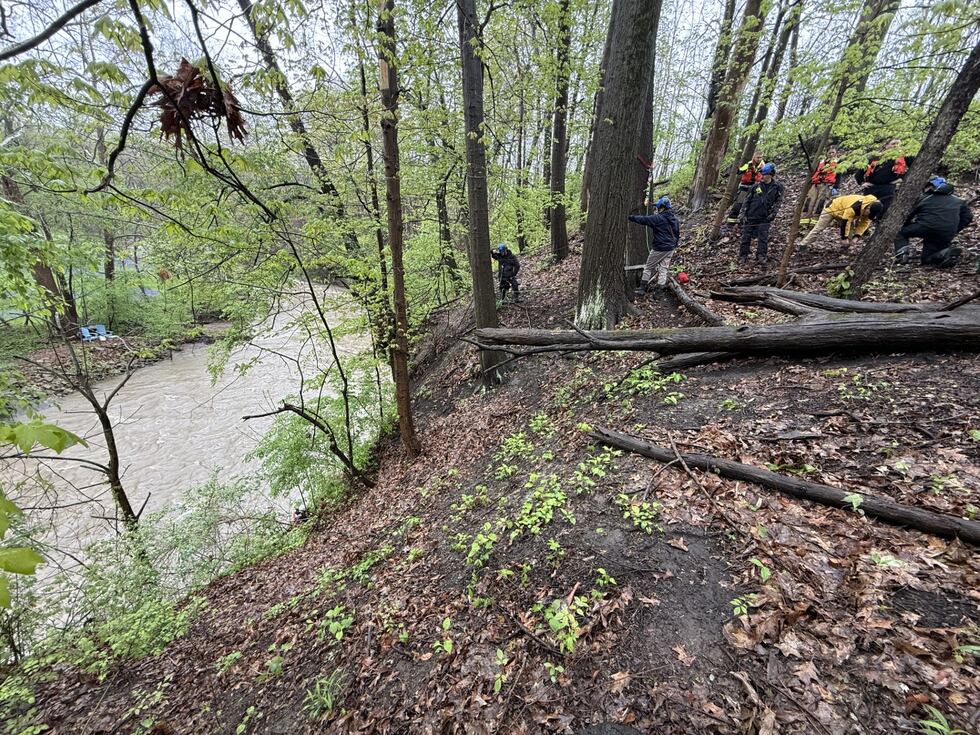 Bedford firefighters rescue man who fell down embankment near rising creek Bedford firefighters rescue man who fell down embankment near rising creek